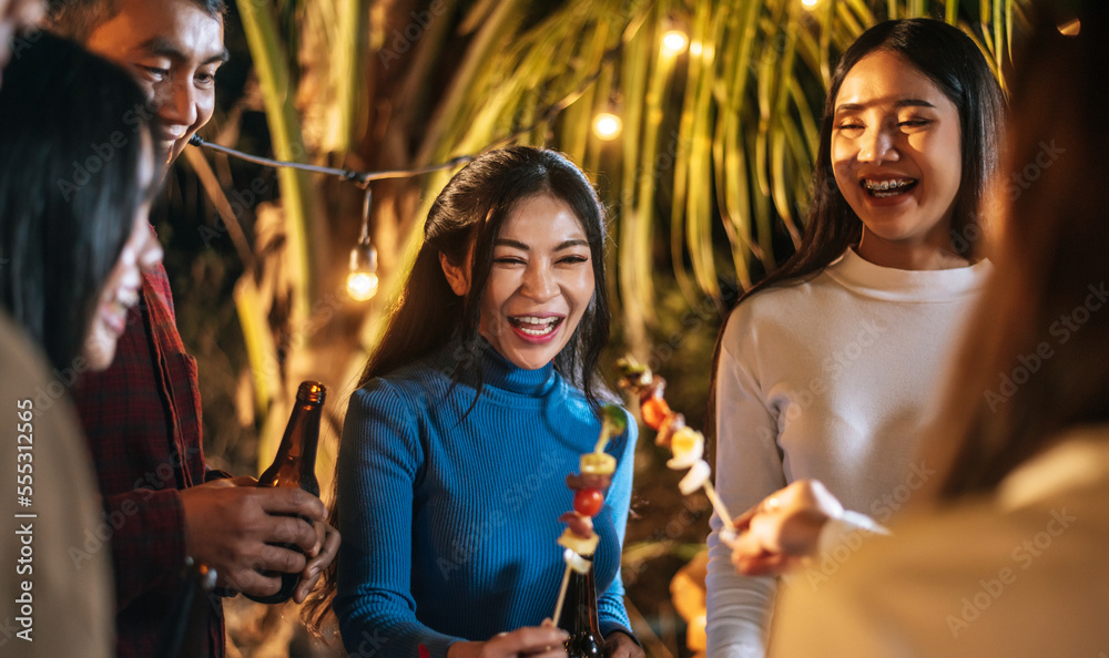 Happy Asian friends cheering with barbecue dinner outdoor - Group of ...
