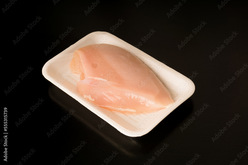 Raw and fresh boneless and skinless chicken breast in styrofoam tray ...