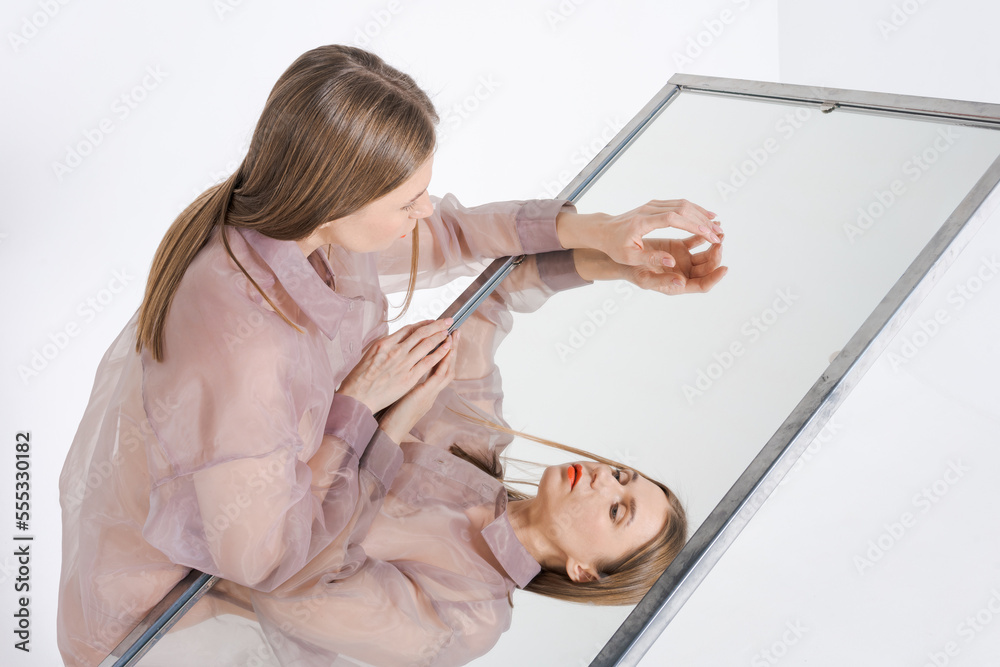 Self-realization portrait woman in mirror image. Unusual strange pretty ...