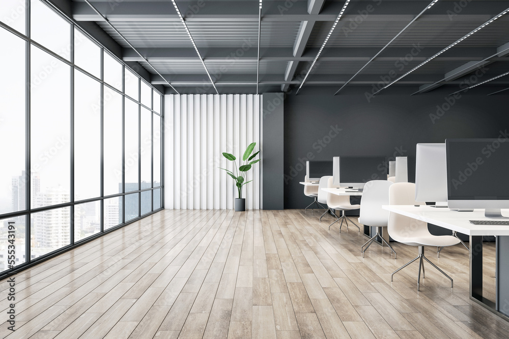 Side view on stylish workspace tables with modern computers in open ...