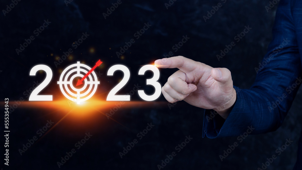 Business target and goal 2023 icon, hand pointing holding 2023 virtual screen, Start new year ...