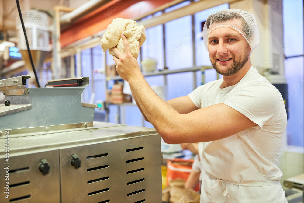 Baker apprentice in training with dough for baking Stock Photo | Adobe ...
