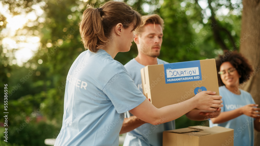 Positive Group of Volunteers Preparing Humanitarian Aid and Donations ...