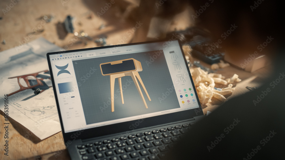 Over the Shoulder Shot of a Furniture Designer Working on Laptop ...