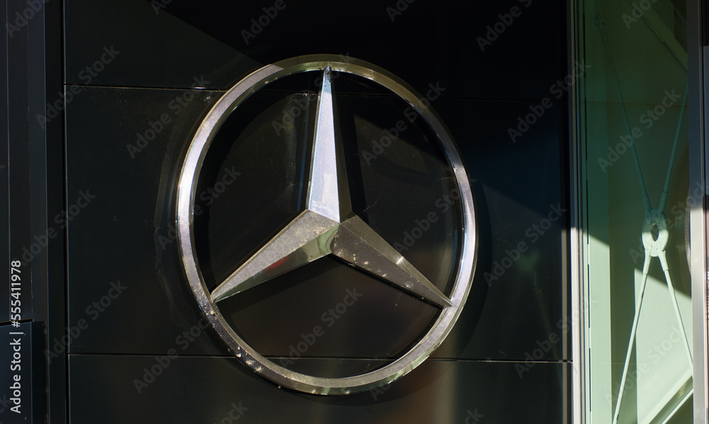 logo and sign of Mercedes Benz placed on the facade of a garage in ...