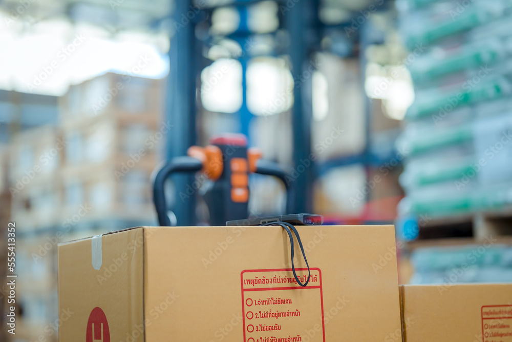 Bluetooth barcode scanner in front of a modern warehouse . Logistics ...