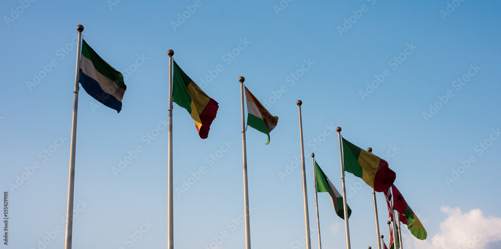 Flags of different shades representing various countries aligned in the ...