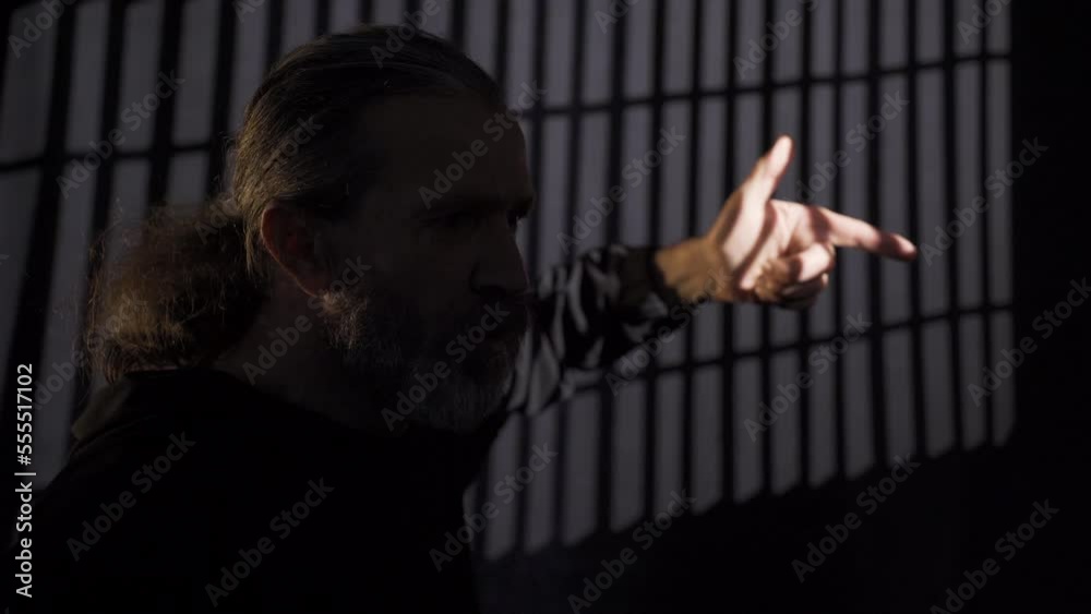 The guilty man is questioned by detectives in the interrogation room ...