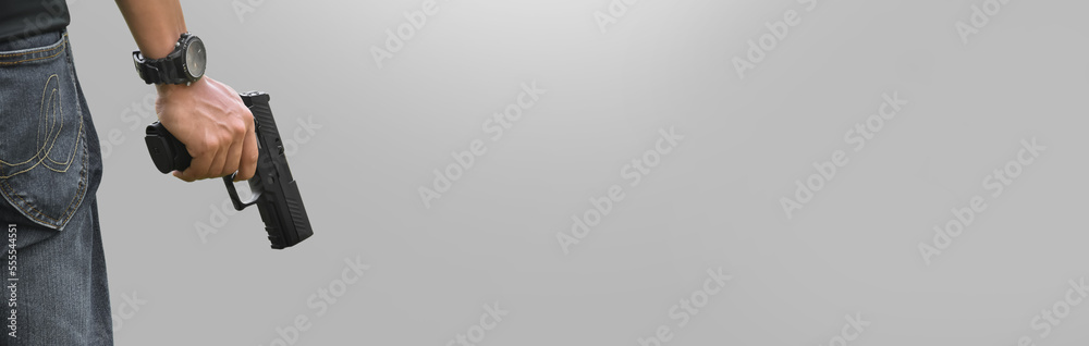 Isolated 9mm pistol gun holding in right hand of gun shooter with ...