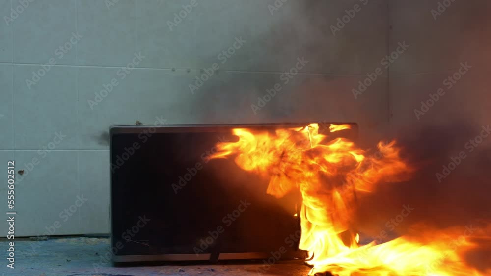 microwave oven on fire. the concept of fire in the kitchen and ...
