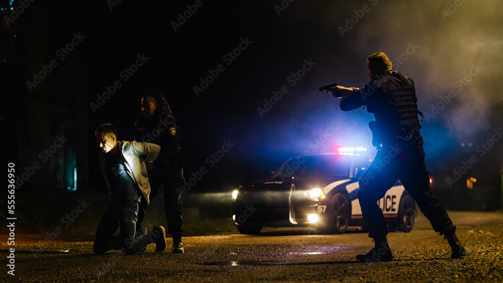 Two Police Officers Catch and Put Suspect Under Arrest. Cops Aiming ...