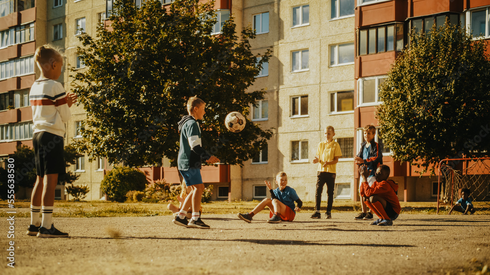 Young Multiethnic Kids Playing with Ball in the Neighborhood. Young Boy ...