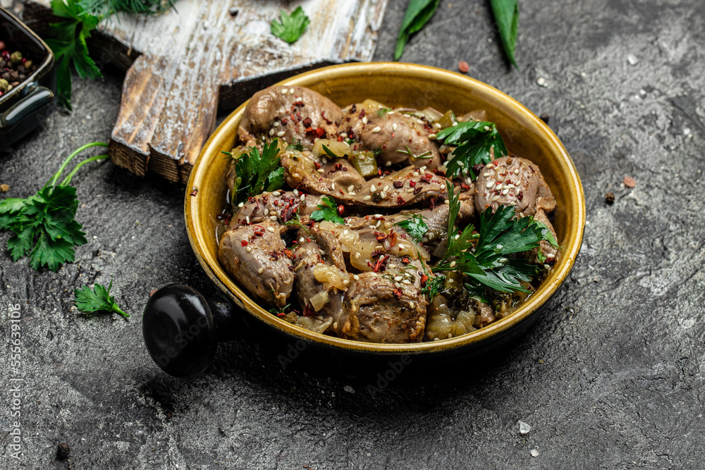 Stewed chicken stomach in pan. Traditional Korean spicy chicken meat on ...