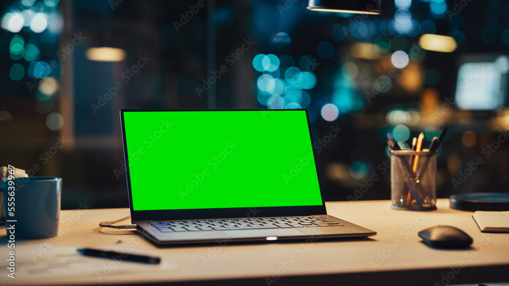 Laptop Standing on a Desk with a Green Screen Chromakey Mock Up Display ...