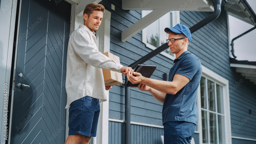 Handsome Young Homeowner Receiving an Awaited Parcel from a Cheerful ...