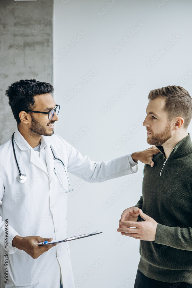 Patient having a visit at doctor making check-up Stock Photo | Adobe Stock