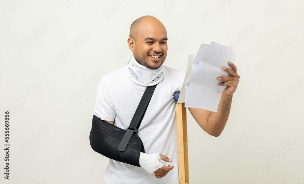 Asian man broken arm and leg holding bill payment. Man put on plaster ...