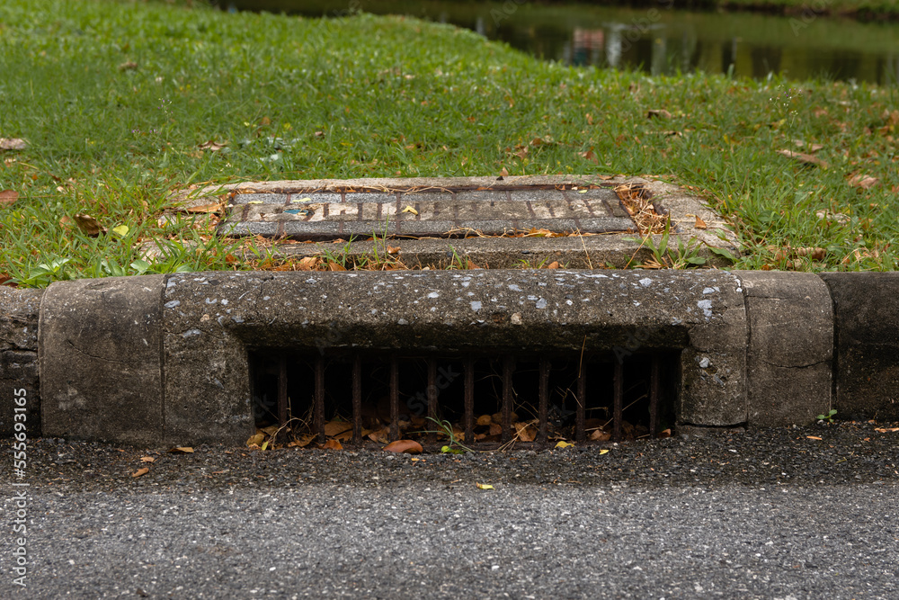 Old fashioned curbside storm drain Stock Photo | Adobe Stock