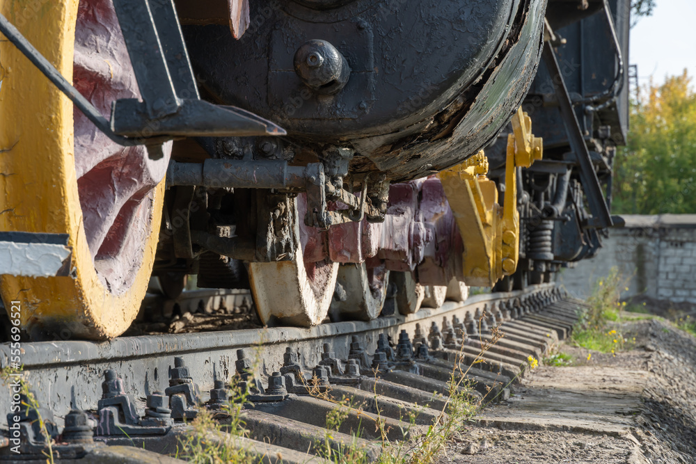 Close-up drive wheels and rods on steam engine locomotive. Vintage part ...
