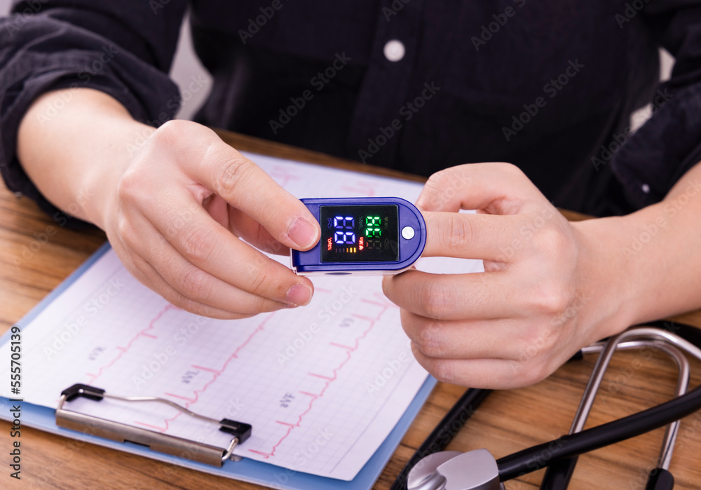 Blood oxygen saturation was measured with a pulse oximeter Stock Photo ...
