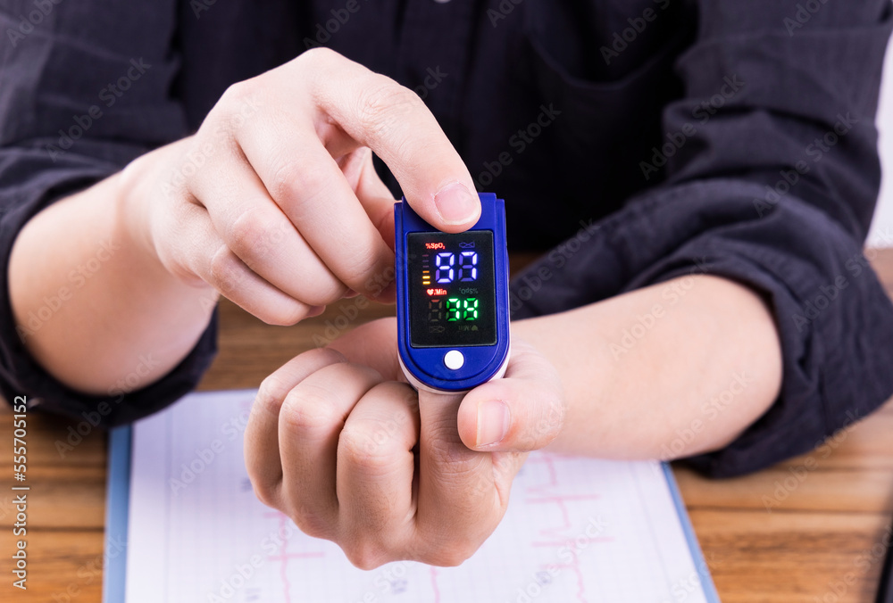 Blood oxygen saturation was measured with a pulse oximeter Stock Photo ...