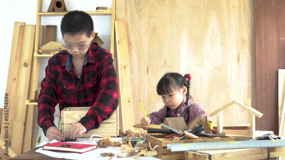 Asian sibling kids having fun play woodwork together, teen boy enjoy ...