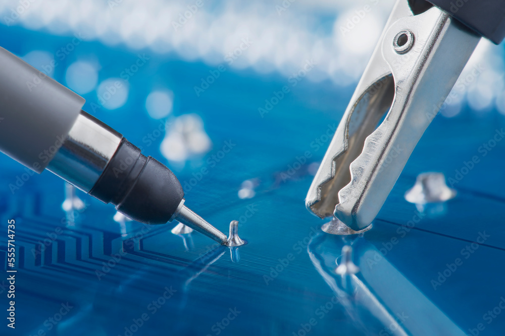 Measuring electronic signal using oscilloscope on the PCB. Electronics ...