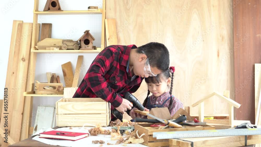 Asian sibling kids having fun play woodwork together, teen boy enjoy ...