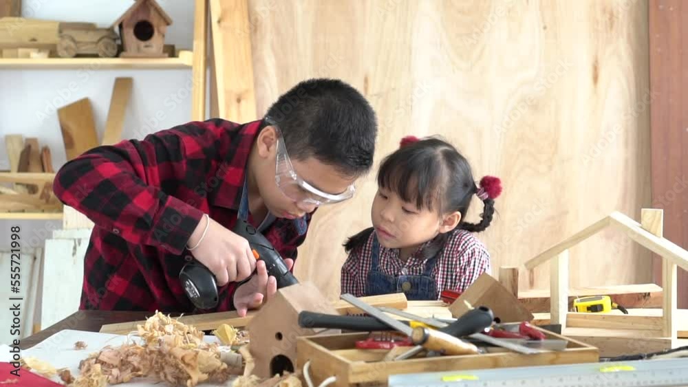 Asian sibling kids having fun play woodwork together, teen boy enjoy ...