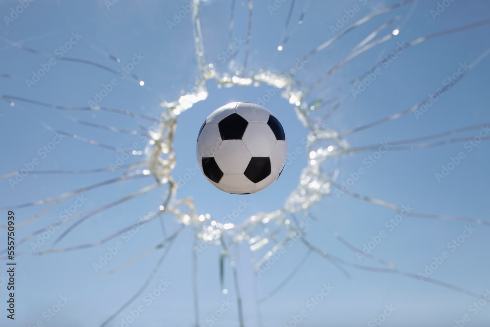 Soccer Ball Smashing through Window Stock Photo | Adobe Stock