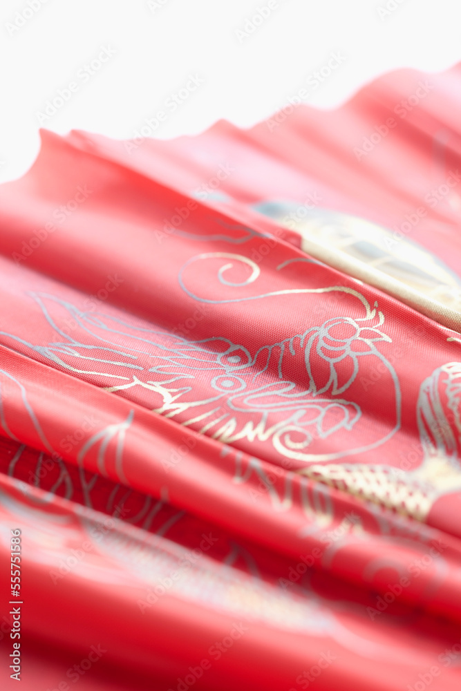 Red Handheld Fan Stock Photo | Adobe Stock