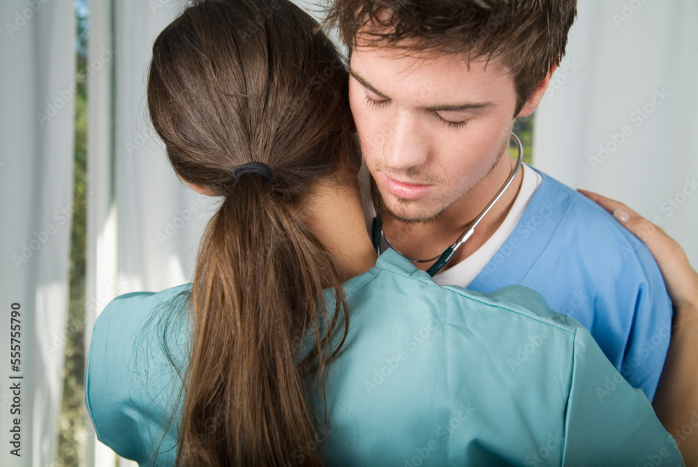 Doctor and Nurse Hugging Stock Photo | Adobe Stock