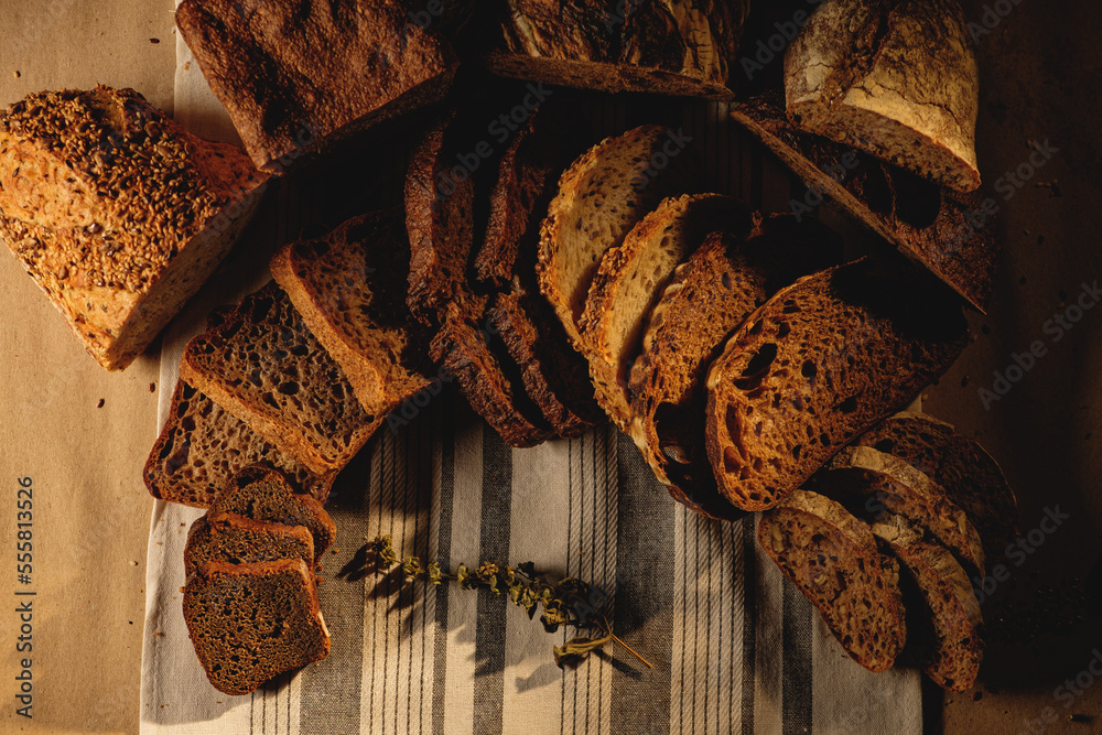 Bread, traditional sourdough bread, cut into slices on a rustic ...