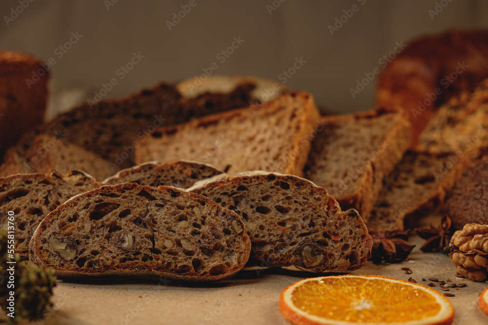 Bread, traditional sourdough bread, cut into slices on a rustic ...