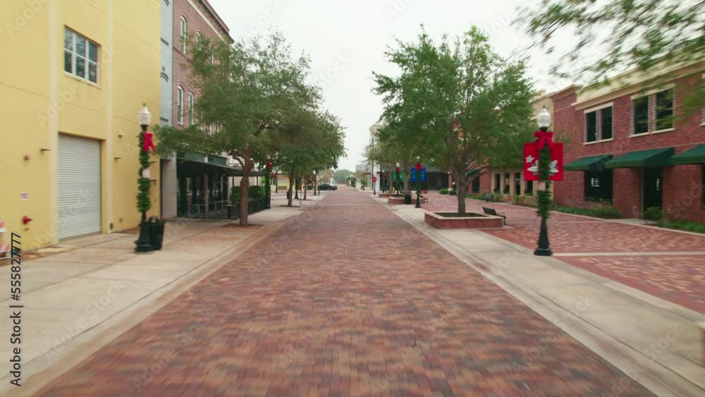 Low Aerial view of the charming brick roads of Downtown Winter Garden ...