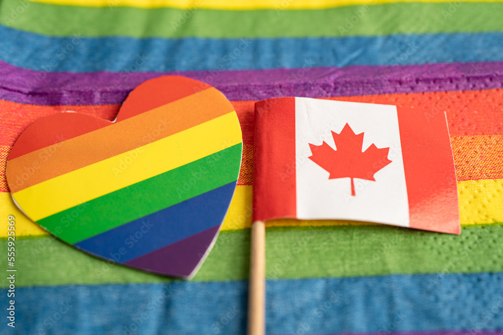 Canada flag on rainbow background symbol of LGBT gay pride month social ...