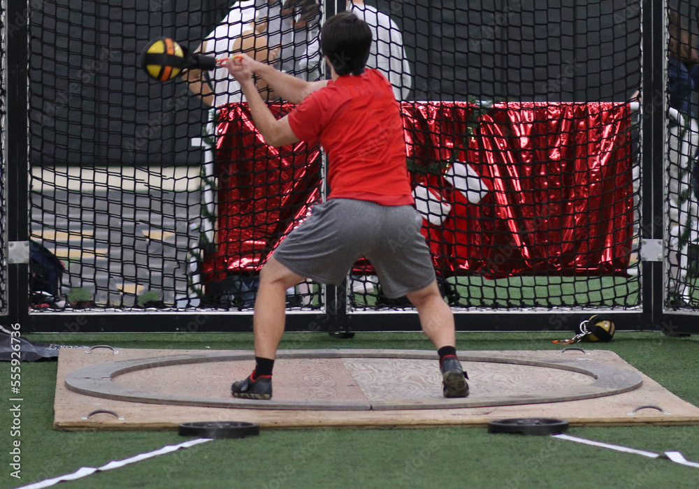 Athlete in a hot put circle throwing an indoor weight Stock Photo ...