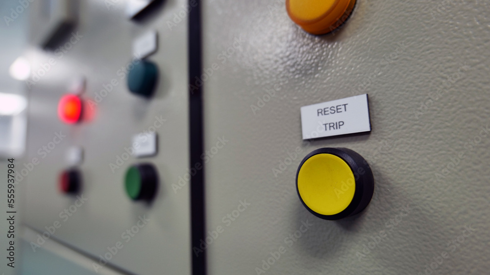 Electric control cabinet with control buttons and lamps indicating the ...