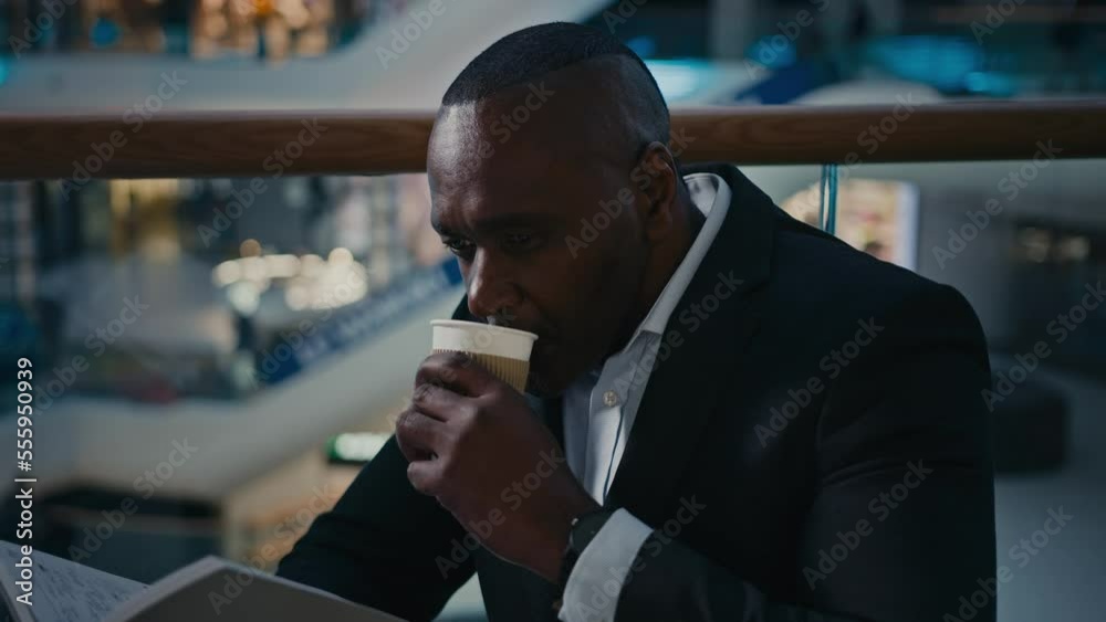 Ethnic male African man businessman employer entrepreneur drinking tea ...