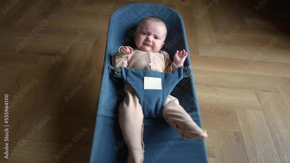 newborn baby in a rocking chair. happy family kid dream concept ...