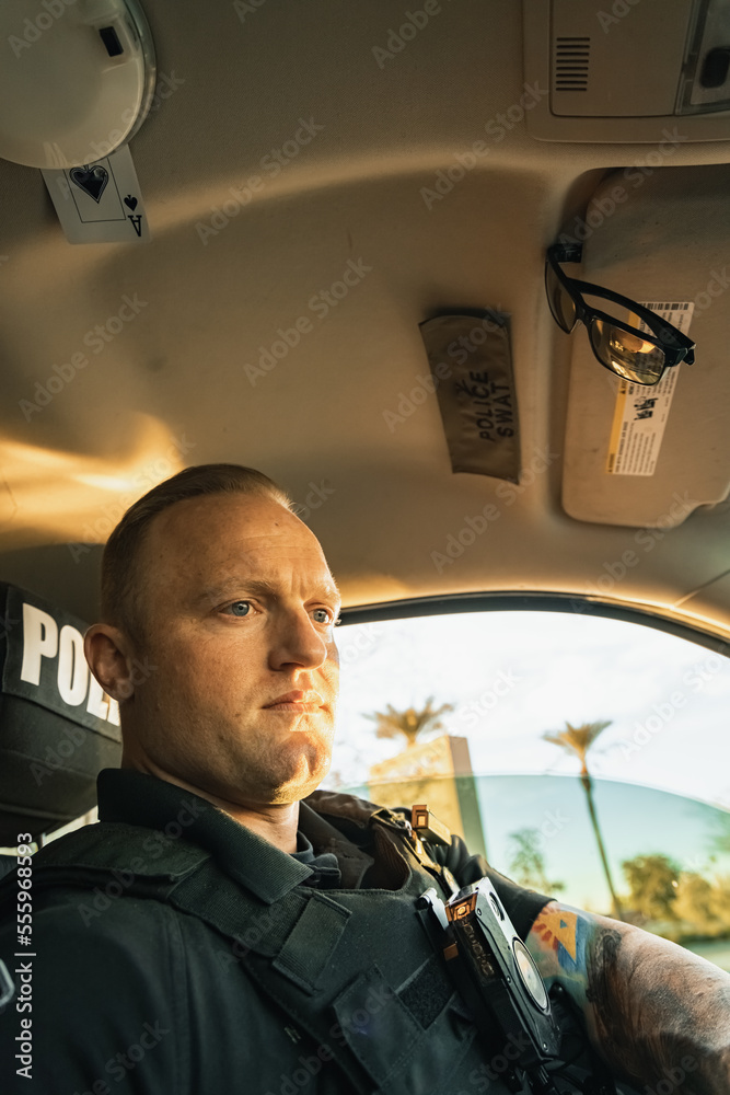 Vertical image low angle shot of of white male caucasian police officer ...