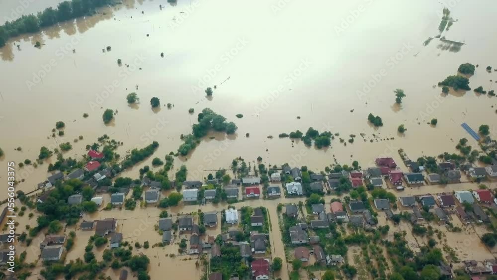 Destruction, heavy rain, flood water. Flood affected house on streets ...