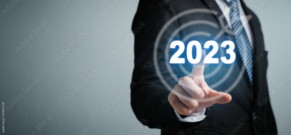 Goals, plans and vision for new year 2023. Businessman drawing arrow ...