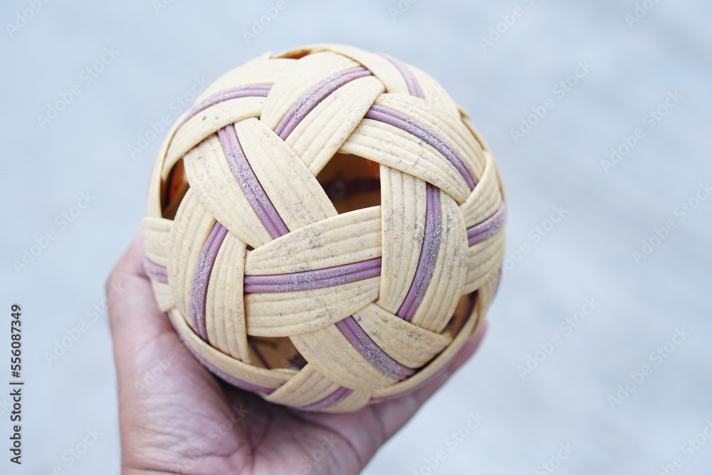 Sepak takraw ball on the hand Stock Photo | Adobe Stock