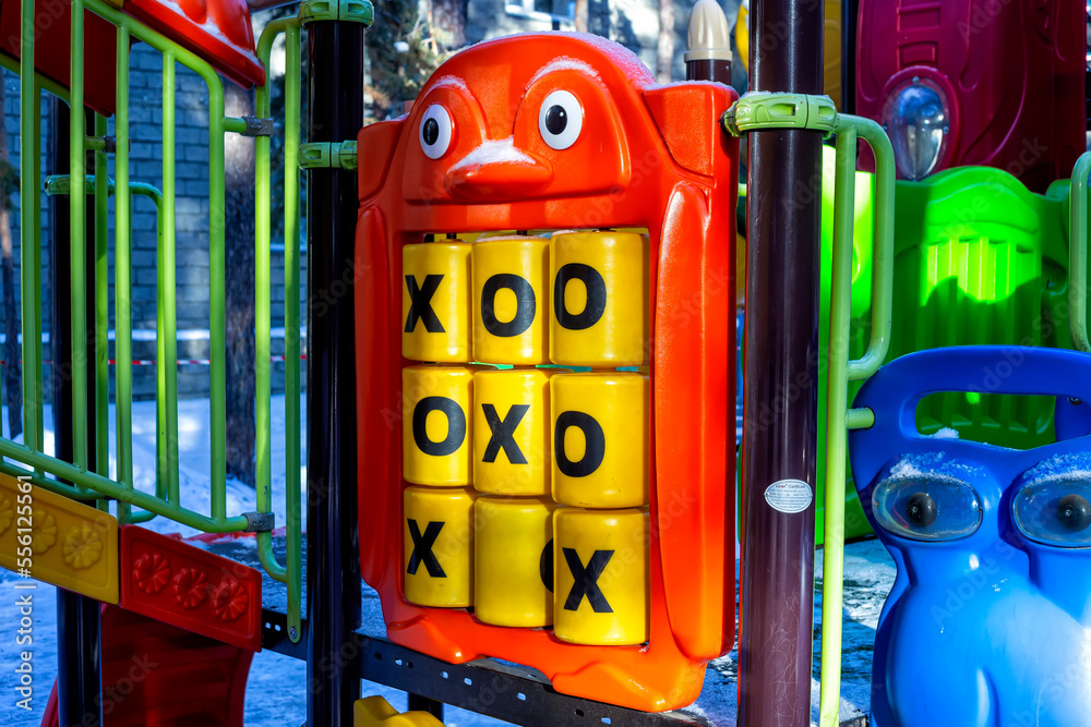 Playground with tic-tac-toe game for children. Rotating shafts on a rod ...