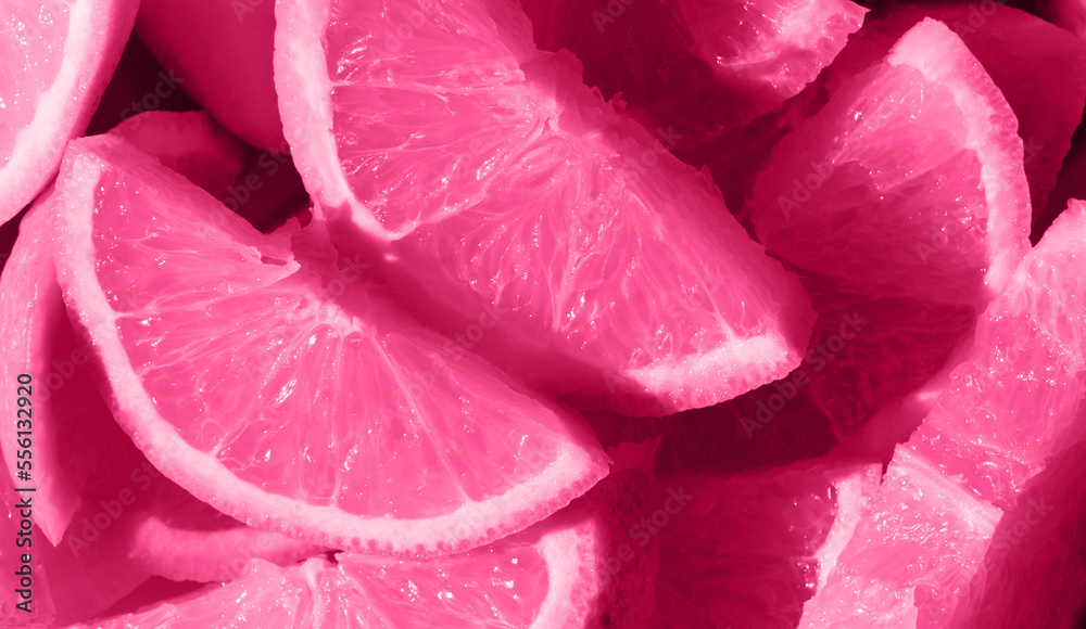 Viva magenta color of the year 2023. Sliced orange juicy oranges in ...