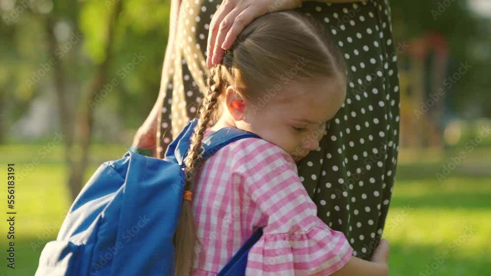Happy family, mother meets child from school, family hugs. Daughter ...