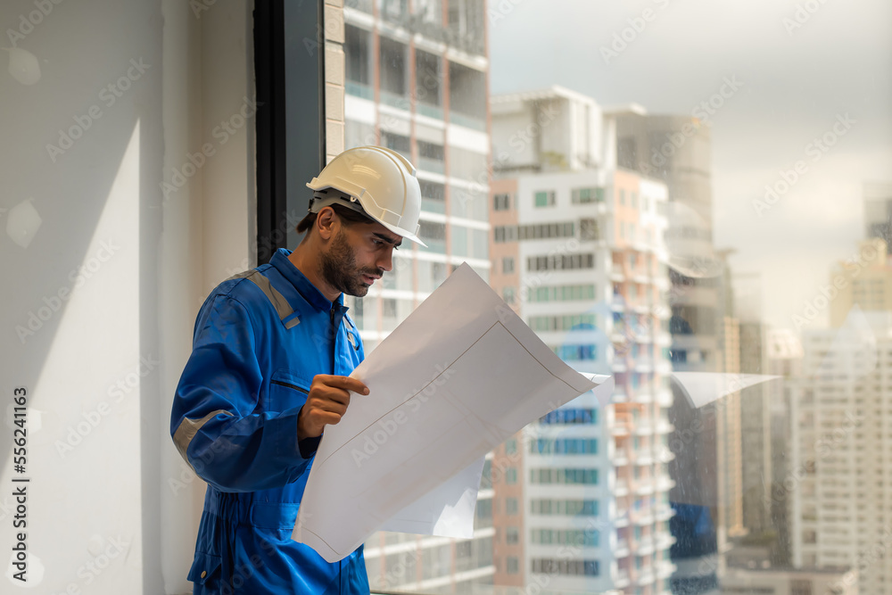 Arab civil engineer wearing safety uniforms workwear Standing holding a ...