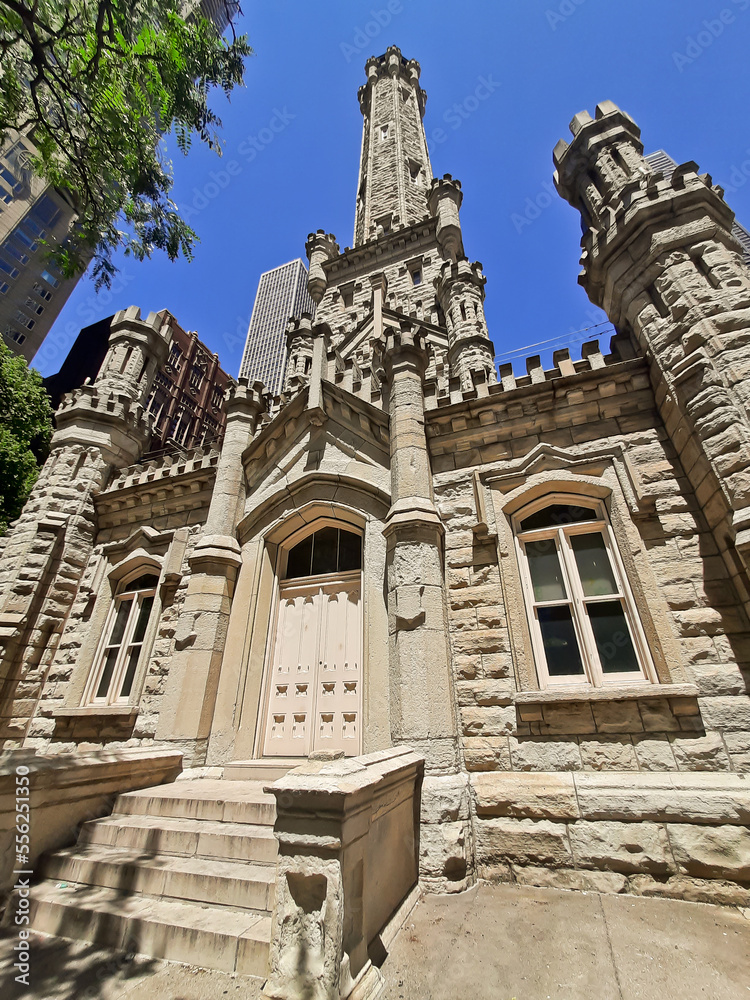 Chicago, IL - May 17th, 2022: People pass by the Chicago Water Tower ...