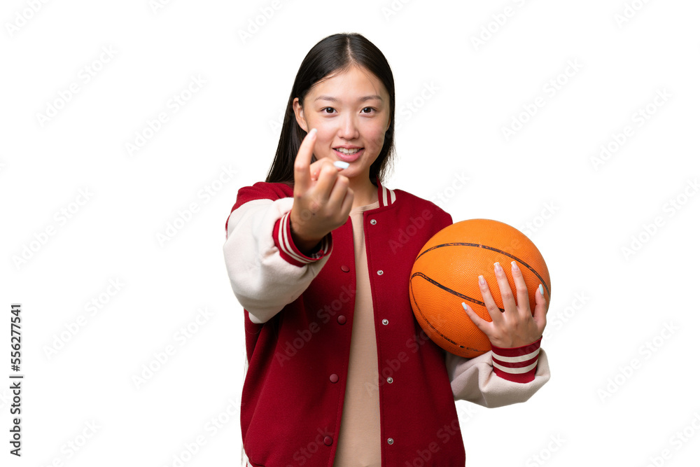 Young basketball player asian woman over isolated background doing ...